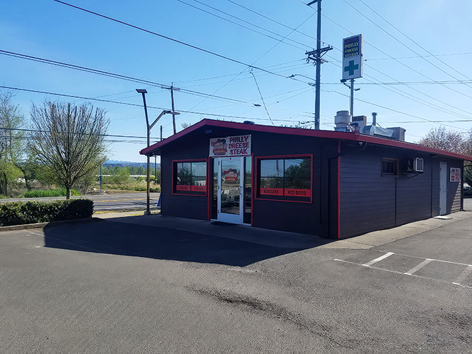 The unassuming burgundy exterior of Grant's might not scream "food destination," but that neon "OPEN" sign is your gateway to cheesesteak paradise.