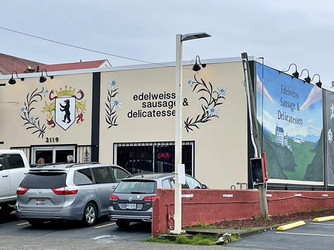 The iconic cream-colored exterior of Edelweiss, with its charming alpine flower logo, stands as Portland's beacon of German culinary tradition.