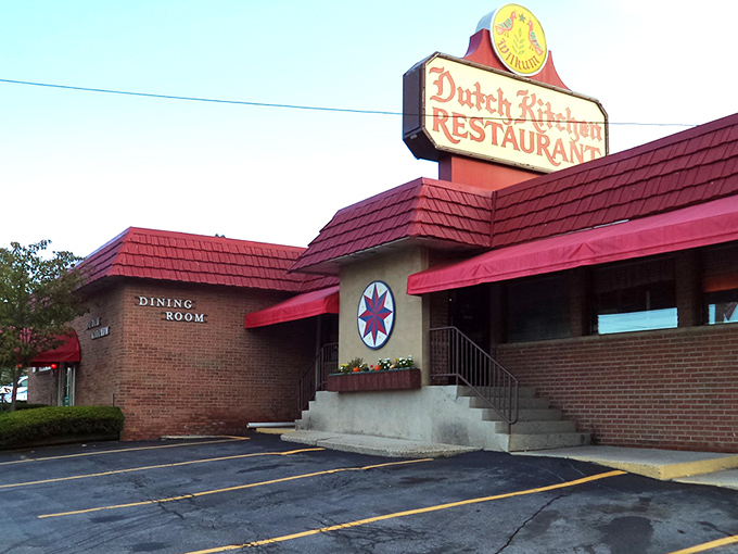 The iconic red-roofed Dutch Kitchen stands like a beacon of comfort food promise, complete with spring tulips that seem to bow in culinary reverence. 