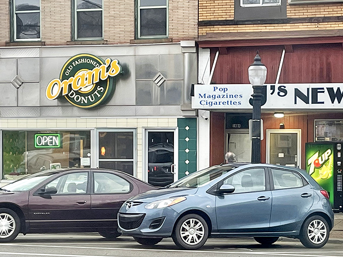 The green and gold storefront beckons like a lighthouse for the sugar-deprived. Since 1938, this humble facade has witnessed countless donut pilgrimages.