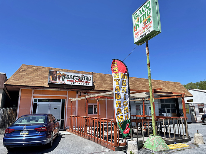 The bright orange exterior of Taco King stands like a beacon of culinary promise on Allentown Boulevard. Your taste buds' happy place awaits!