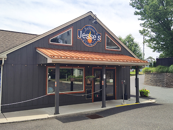 Jesse's welcoming exterior beckons hungry travelers with its rustic charm and copper accents. The promise of barbecue paradise awaits behind those doors.