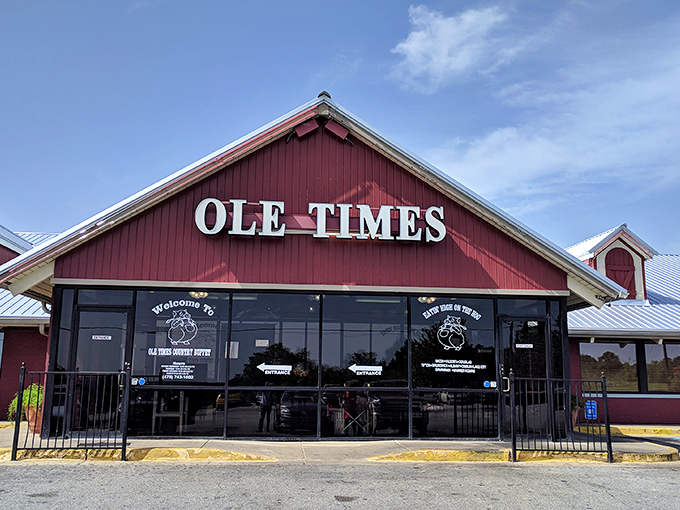 The iconic red barn exterior of Ole Times Country Buffet stands like a beacon of Southern comfort food, promising delicious abundance within those welcoming walls.