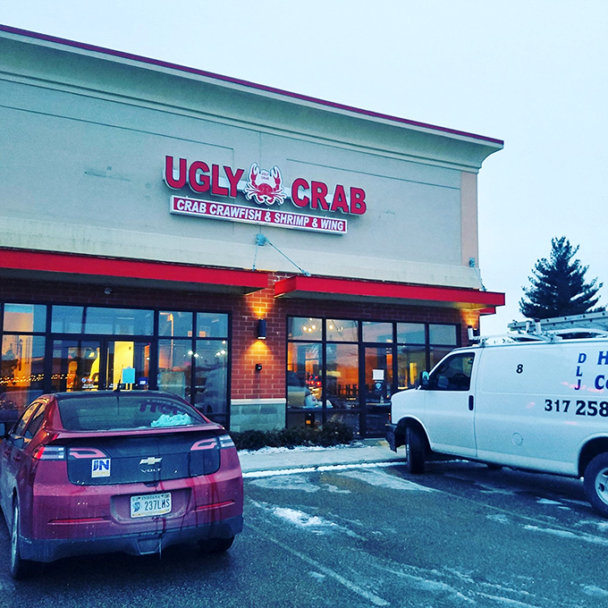 Ugly Crab stands proudly in a strip mall sanctuary, proving that seafood paradise can exist between a Thai restaurant and a parking lot.