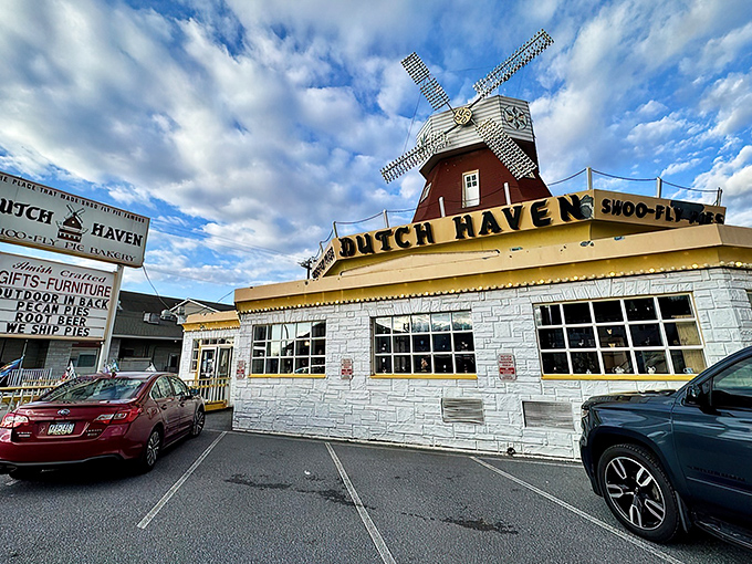 The iconic windmill atop Dutch Haven stands like a lighthouse for dessert lovers, guiding hungry travelers to pie paradise on Route 30.