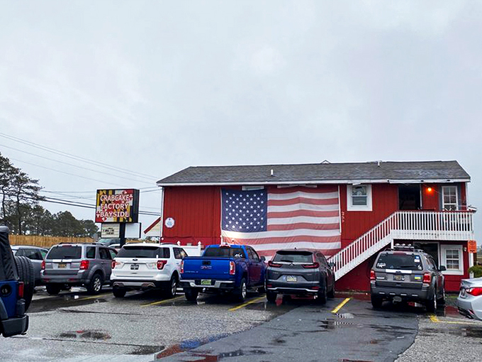 The red roof of CCF Bayside beckons like a lighthouse for the hungry. Rustic wooden exterior with character that says "seafood secrets inside."