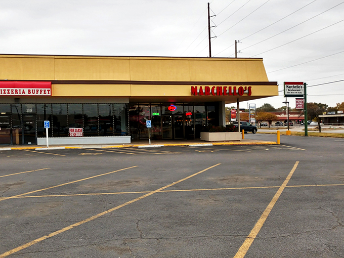 The bright red Marchello's sign stands out like a culinary lighthouse, beckoning hungry travelers to this unassuming strip mall treasure in Wichita.