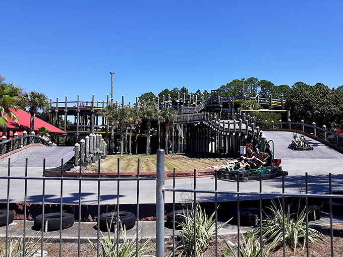 Racing around the bend, these go-karters experience that perfect moment when childhood joy meets adult competitive spirit. Those colorful tires aren't just for show&mdash;they're dream cushions for wannabe NASCAR stars.