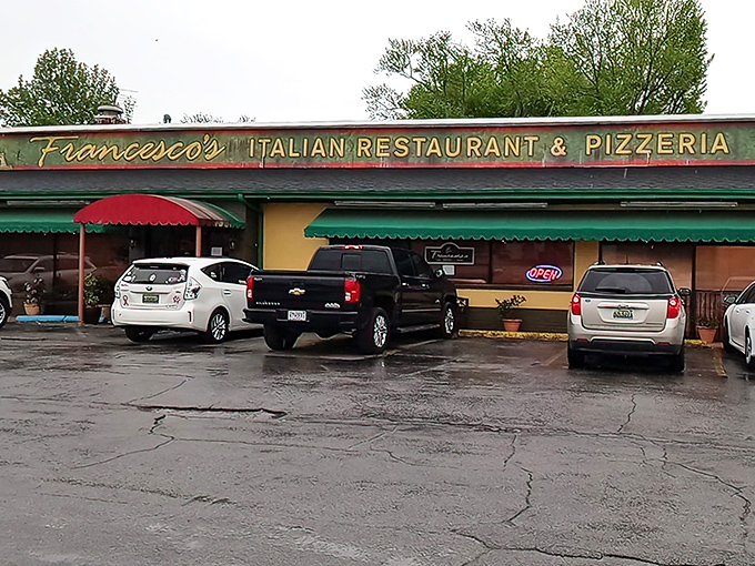 The cheerful yellow exterior with its red and green awnings isn't just inviting&mdash;it's practically shouting "authentic Italian food inside!" like a culinary town crier.