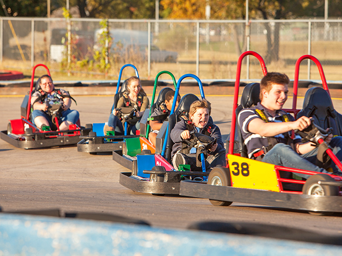 The winding track at Lokomotion beckons speed demons of all ages. Those red and blue barriers aren't just for show&mdash;they've caught many an overzealous driver with NASCAR dreams.