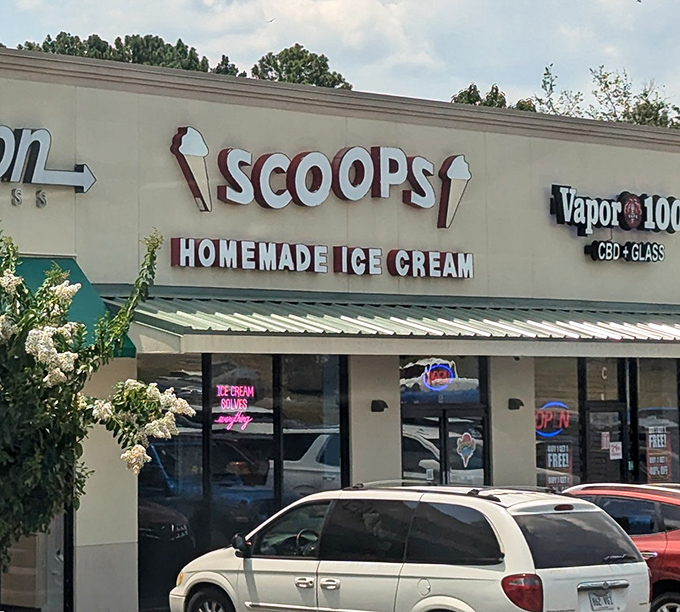 Scoops Homemade Ice Cream stands proudly in Hot Springs, its cheerful yellow facade promising sweet relief from Arkansas summer heat. The "OPEN" sign never looked so inviting.