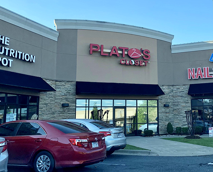 The tan fa&ccedil;ade and bold red signage of Plato's Closet beckons like a fashion oasis in the suburban retail landscape.