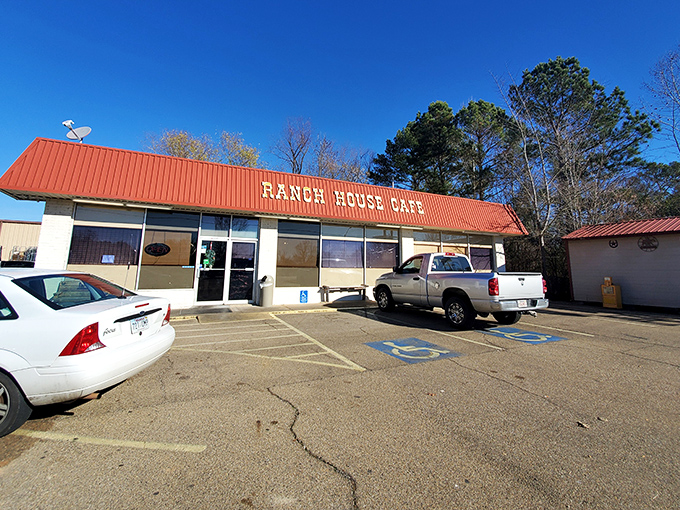 The bright red roof of Ranch House Cafe beckons hungry travelers like a culinary lighthouse on the Arkansas horizon.