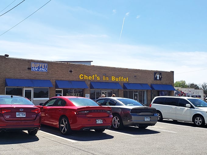The unassuming brick exterior with bright blue awnings is like a culinary Clark Kent – ordinary on the outside, superhero-level deliciousness within.