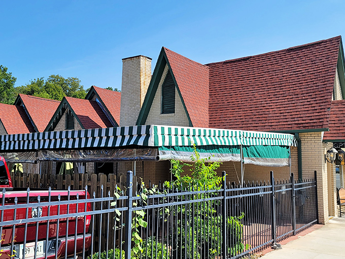 The charming cream brick exterior of Best Cafe & Bar feels like a time capsule of Hot Springs history, complete with those classic green awnings.