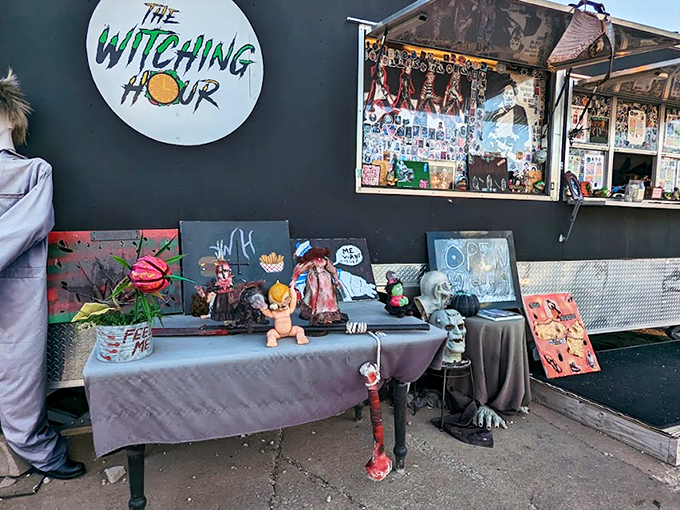 This isn't your average food truck &ndash; it's a haunted mansion on wheels, beckoning hungry souls with its matte black exterior and pink neon logo.