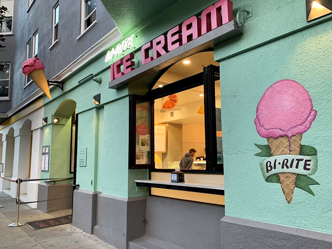The mint-green facade with its vintage neon sign beckons like a siren song. San Francisco's ice cream pilgrimage site glows invitingly against the evening sky.