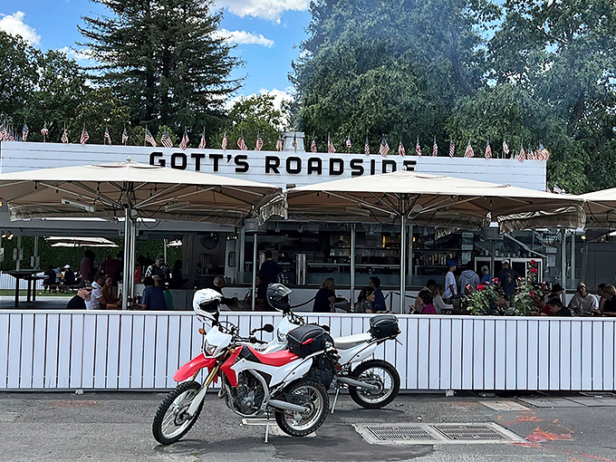 The iconic white exterior of Gott's Roadside with its bold "EAT" sign—a siren call to hungry travelers that brooks no argument.