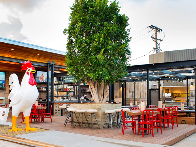 The rustic-industrial exterior of The Crack Shack beckons like a chicken-lover's mirage in Little Italy, where casual meets culinary genius under the San Diego sun.