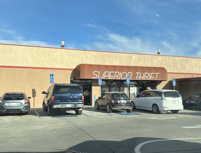 The unassuming exterior of Superior Thrift belies the wonderland of bargains waiting inside. Like a treasure chest with automatic doors, it beckons to savvy shoppers.