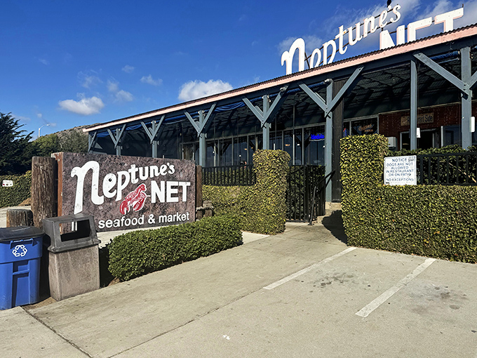 Where motorcycles meet the sea: Neptune's Net stands proudly along PCH, a weathered wooden beacon for hungry travelers and weekend riders alike.