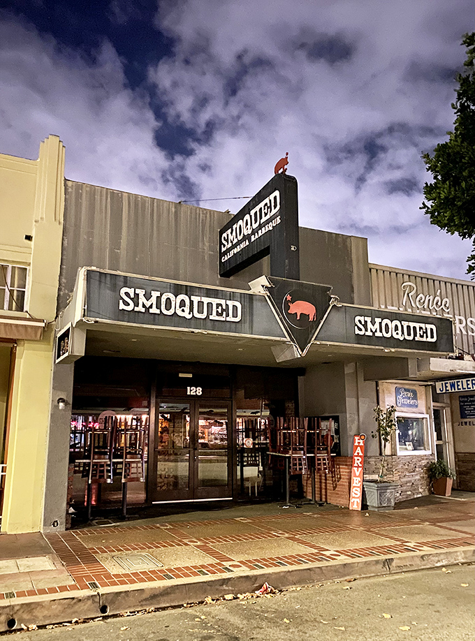 The pink pig silhouette perched atop Smoqued's sign isn't just cute &ndash; it's a beacon of hope for BBQ lovers wandering the California desert of mediocre meat.