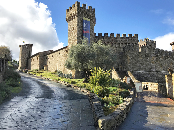 The castle's imposing entrance, complete with menacing gargoyle guardian, makes Disney's Cinderella Castle look like a starter home. Medieval intimidation meets California sunshine.