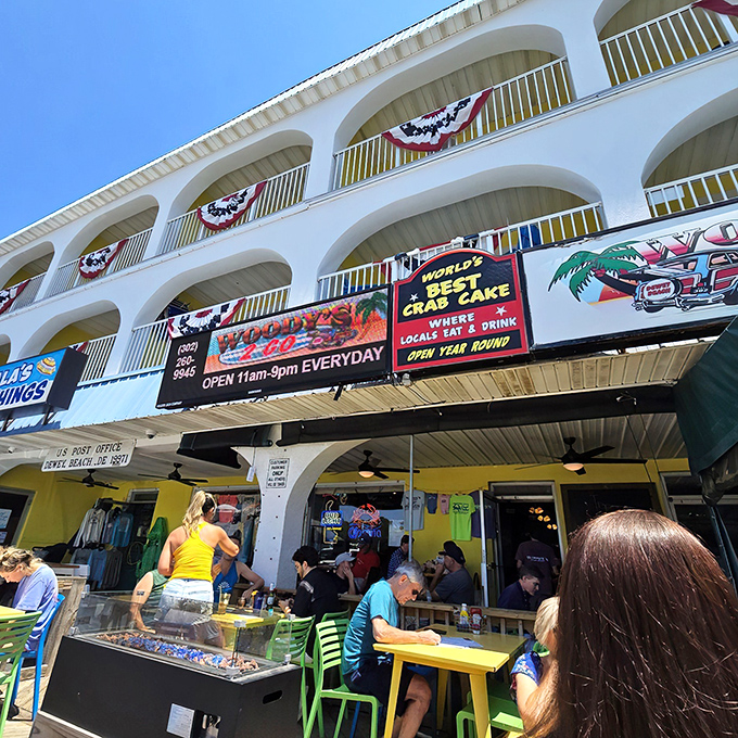 The unassuming blue-trimmed exterior of Woody's stands like a beacon of culinary promise amid Dewey Beach's laid-back coastal charm.