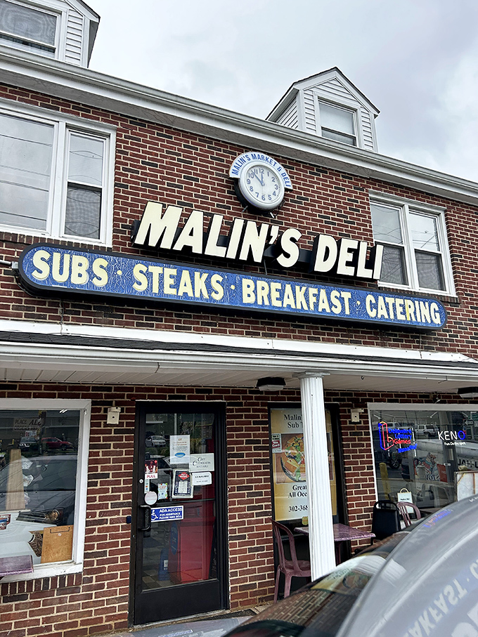 The brick facade of Malin's Deli stands as a beacon of sandwich salvation in Newark, promising subs, steaks, breakfast, and catering to hungry Delaware residents.