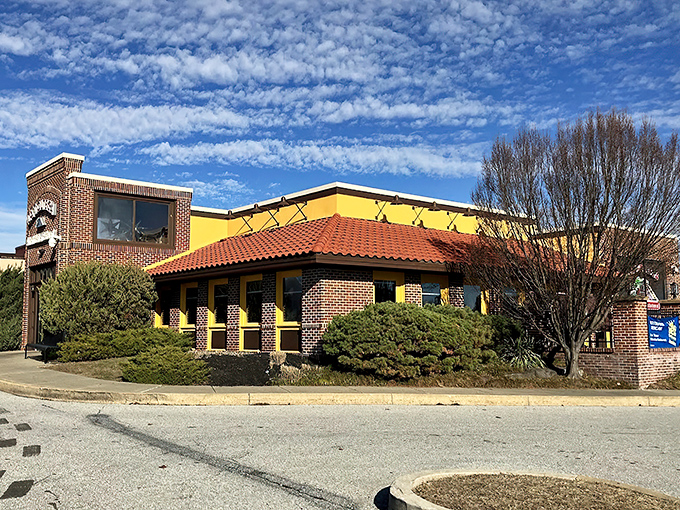 La Tolteca's sunny yellow exterior with terracotta roof stands like a beacon of culinary promise against Delaware's sky. No architectural awards here&mdash;just the promise of authentic flavors inside.