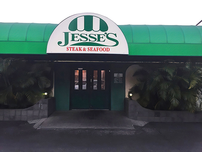 The iconic green awning of Jesse's Steak & Seafood stands as a beacon for hungry Floridians, promising old-school delights within those unassuming doors.