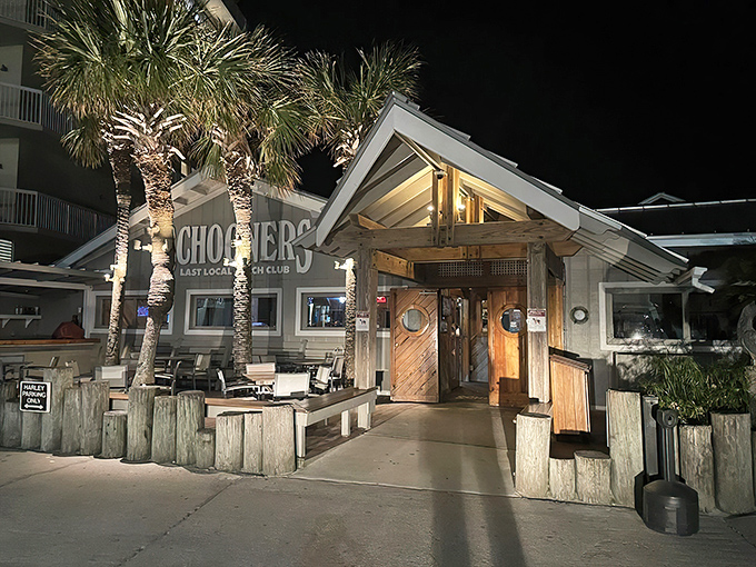 Schooners proudly declares itself "The Last Local Beach Club," where motorcycles park out front like loyal patrons waiting for their seafood fix.