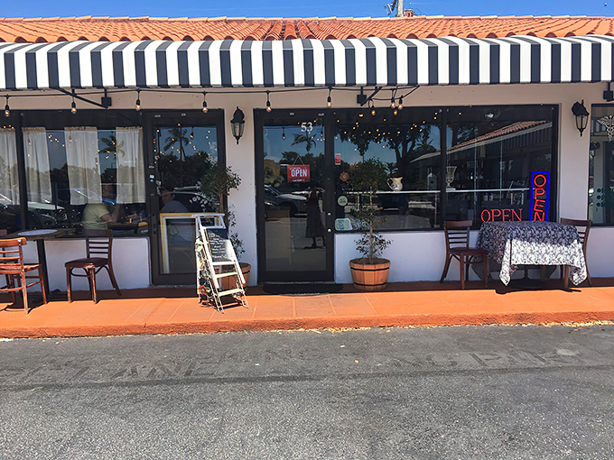 The black and white striped awning and bright red door of La Fresa Francesa isn't just charming&mdash;it's like Paris decided to vacation in Hialeah and never left.