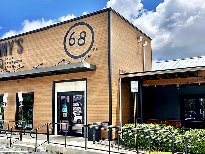 Sonny's wooden fa&ccedil;ade stands like a beacon of barbecue promise, the "68" emblem reminding us some traditions are worth preserving.