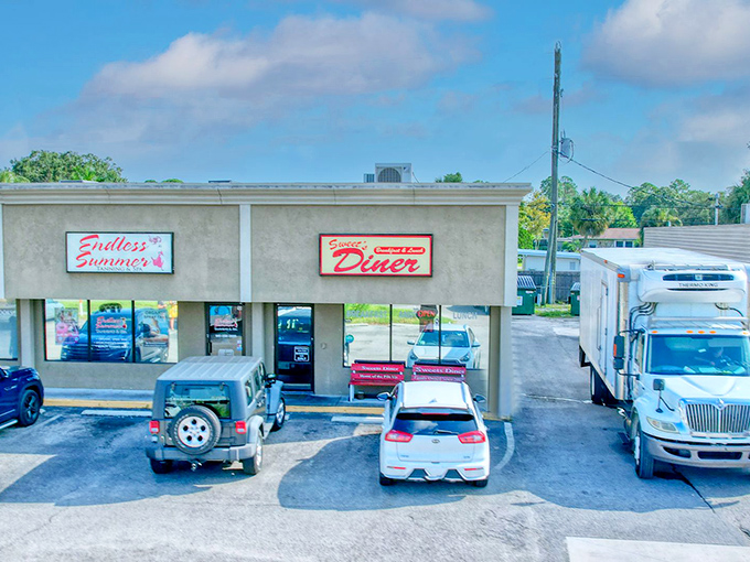 Welcome to flavor town! Sweet's Diner's retro sign promises a trip down memory lane, with a side of crispy bacon.