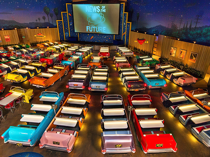 The entrance sets the stage perfectly&mdash;a vintage convertible parked beneath a retro marquee that promises cinematic dining adventures ahead.