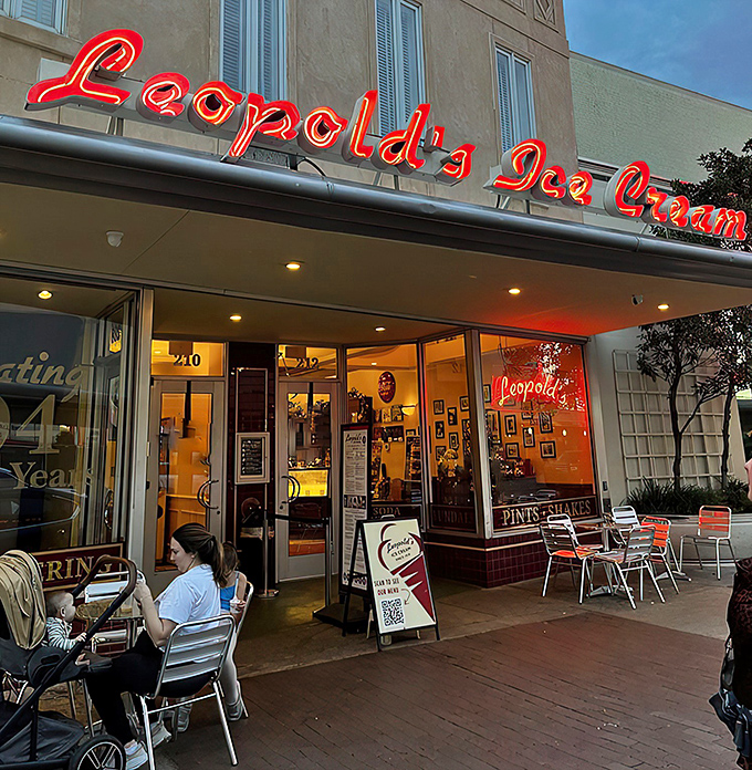 The iconic Leopold's marquee beckons like an old friend. That red neon sign isn't just advertising—it's promising happiness by the scoop.