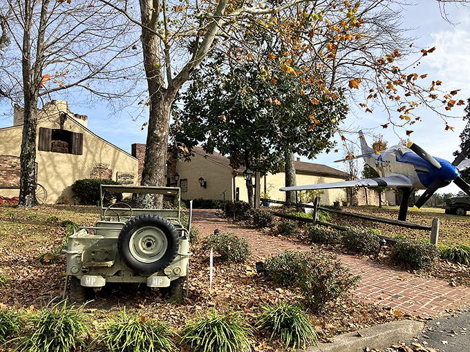 The fortress-like exterior of 57th Fighter Group stands ready for your culinary mission, complete with vintage artillery that's thankfully only targeting your appetite.