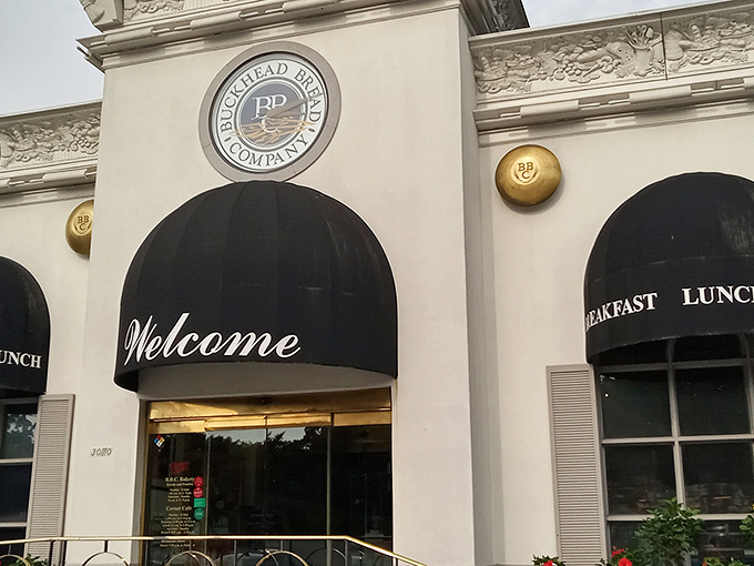 The elegant white facade of Corner Cafe stands like a culinary lighthouse in Buckhead, beckoning hungry Atlantans with promises of breakfast bliss.