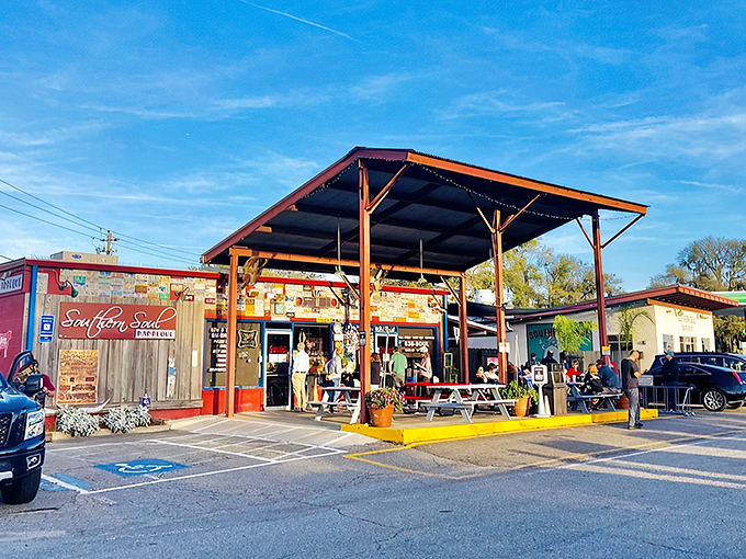 The converted gas station sanctuary where smoke signals beckon hungry pilgrims from miles around. Georgia's coastal barbecue haven awaits beneath that humble wooden awning.