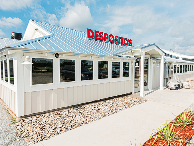 The unassuming white building with that bold red sign might fool you, but locals know&mdash;seafood paradise awaits inside this coastal gem.