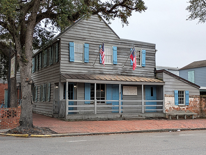 The weathered wooden exterior tells tales older than America itself. This historic landmark has watched Savannah grow from seafaring port to Southern belle.