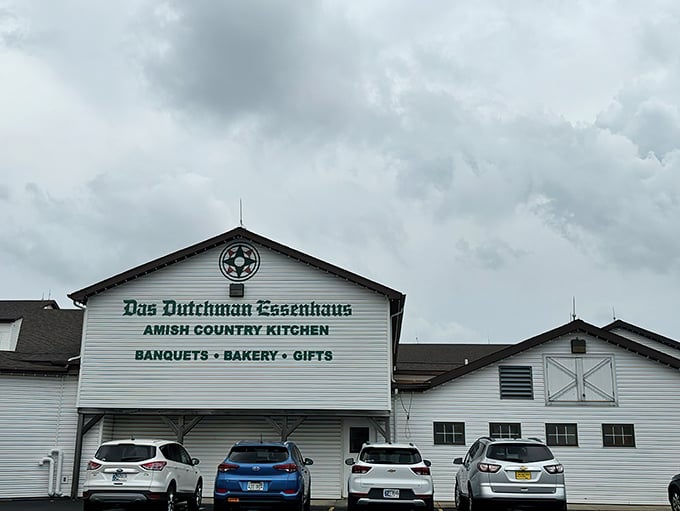 The classic white facade of Das Dutchman Essenhaus announces itself like a culinary lighthouse beckoning hungry travelers to the shores of comfort food paradise.