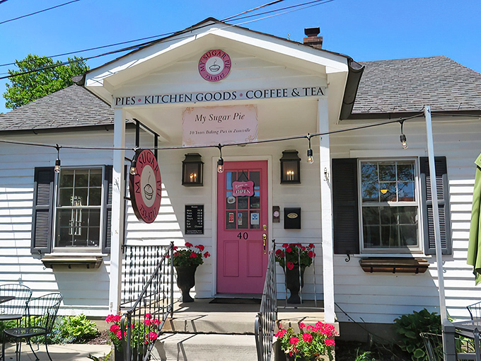 The white cottage with that irresistible pink door isn't just inviting&mdash;it's practically daring you to come inside and indulge.