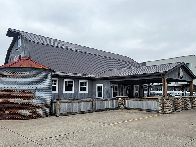 The barn-like facade of The Chubby Trout stands proud with its distinctive silo structure and weathered gray exterior. Rustic charm meets culinary adventure in this unassuming roadside treasure.