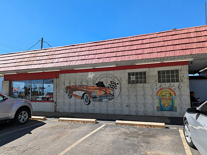 The iconic red roof of Rock-Cola 50's Cafe stands as a beacon of nostalgia along Indianapolis streets. Even the vintage sign promises good times ahead.