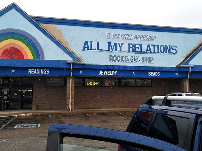 The rainbow-painted facade promises cosmic adventures within, where "CRYSTALS" and "READINGS" boldly announce this isn't your average strip mall tenant. 