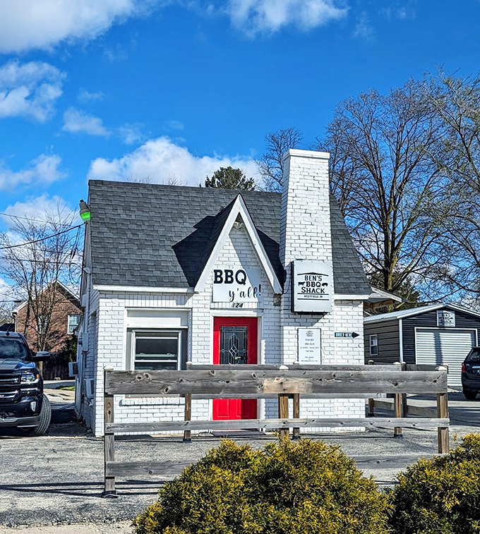 The white brick cottage with its distinctive red door isn't just serving barbecue &ndash; it's serving dreams wrapped in smoke and tucked between bread.