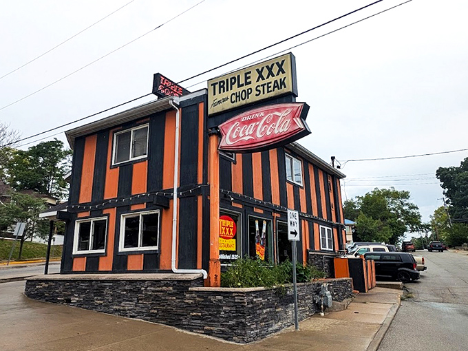 The unmistakable orange and black striped exterior of Triple XXX stands out like a Halloween party that never ended&mdash;in the best possible way.