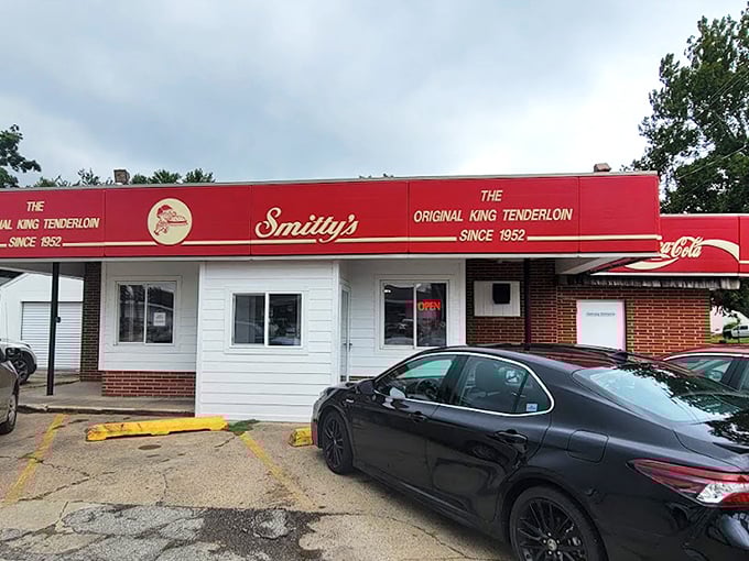 The bright red awning of Smitty's proudly announces "The Original King Tenderloin Since 1952"&mdash;a culinary landmark that's been perfecting pork longer than most of us have been eating it.